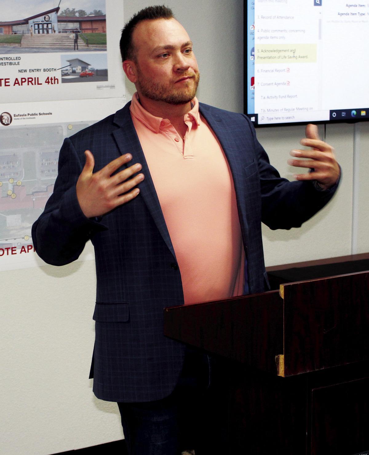 Cade Weaver hands award plaques to his rescuers - Eufala Indian Journal